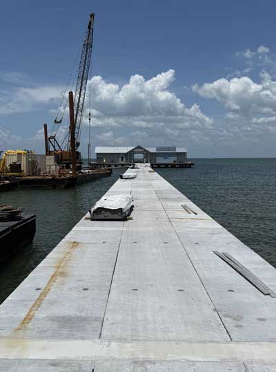 Utility conduits going in for pier walkway - The Anna Maria Islander